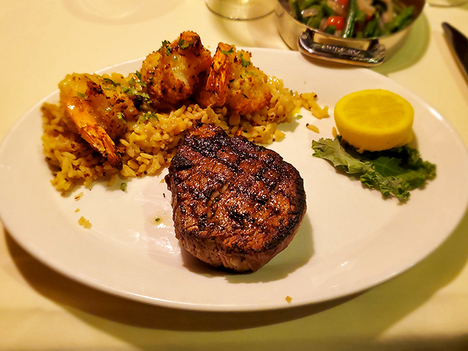 A perfectly cooked filet mignon with jumbo shrimp &ndash; proof that "surf and turf" isn't just a meal, it's a philosophy worth living by.