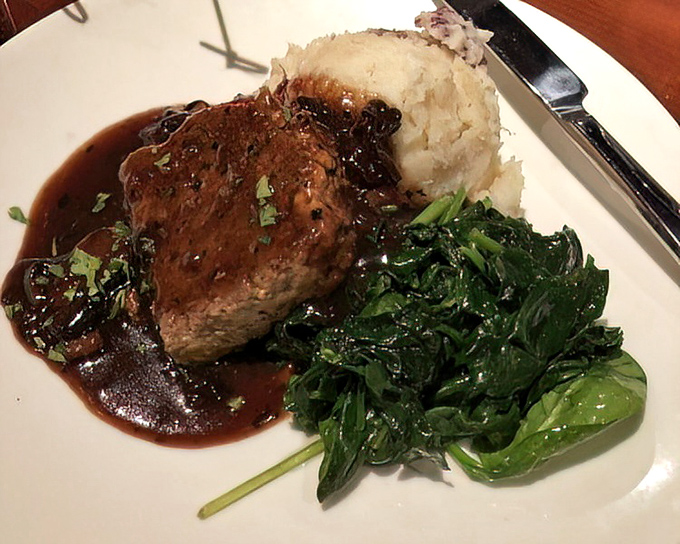 This isn't just meat and potatoes&mdash;it's a plate of nostalgia. Rich sauce pools around tender beef with greens for color (and conscience).