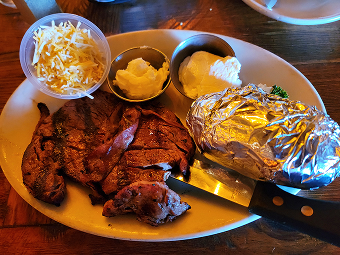 A plate that would make Fred Flintstone jealous&mdash;mesquite-grilled steak with all the trimmings and a baked potato ready for its close-up.