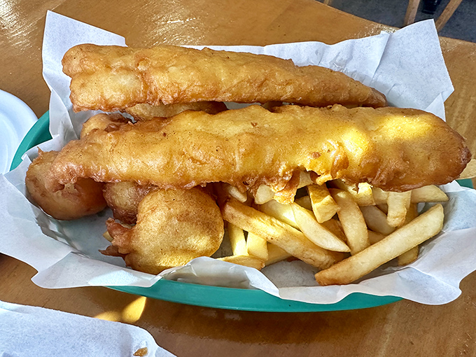 Fish so perfectly battered it practically shatters at first bite, paired with chips substantial enough to stand up to a proper malt vinegar dousing.
