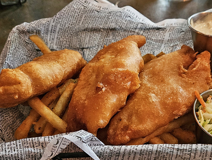 Golden-battered fish that shatters with each bite, served on newspaper because good news travels fast when it's this delicious.