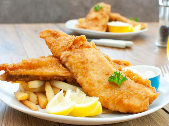 Golden-battered fish that would make even dedicated BBQ enthusiasts temporarily forget about smoked meat. Crispy on the outside, flaky perfection within.