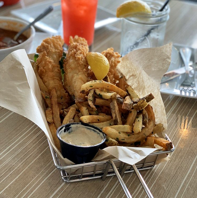Fish and chips that would make a British pub jealous. The crispy batter whispers sweet nothings while those hand-cut fries play wingman.