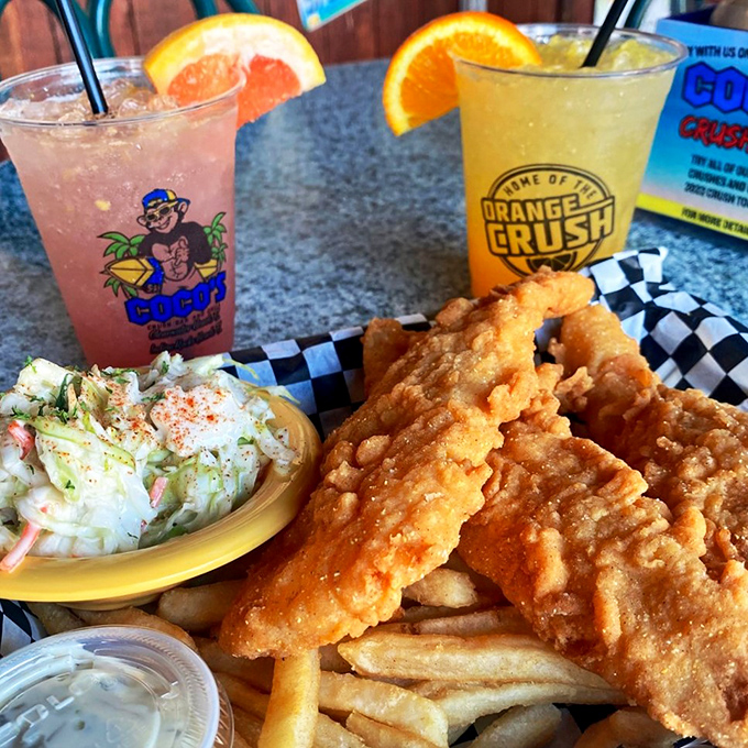 Golden-fried fish that would make Neptune himself trade his trident for a fork, paired with crispy fries and tropical cocktails.