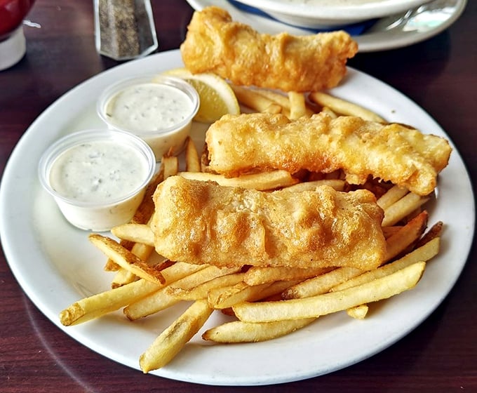 Golden-battered fish that shatters with each bite, paired with fries that could make a Frenchman weep with joy.
