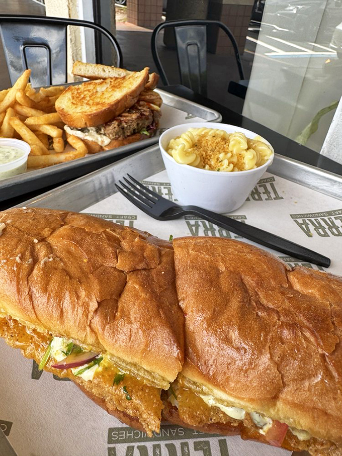 The perfect trifecta: golden fries, creamy mac and cheese, and a sandwich that makes you wonder why you ever settled for drive-thru mediocrity.