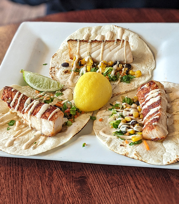 Fish tacos elevated to art form: tender fish, vibrant toppings, and soft tortillas create a harmonious trio that sings with every bite.