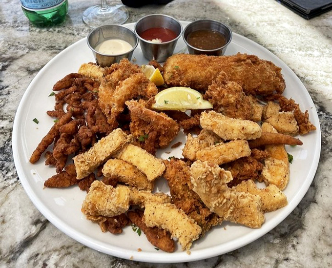 The Fisherman's Platter: where indecision becomes a virtue. A crispy, golden medley of seafood treasures with three dipping sauces for your dunking pleasure.