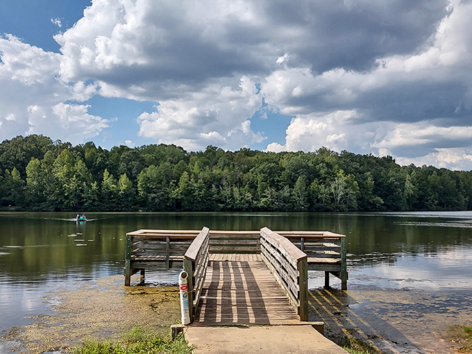 This fishing pier stretches into Lake Crawford like an invitation, promising peaceful hours where "catching nothing" still counts as a perfect day.