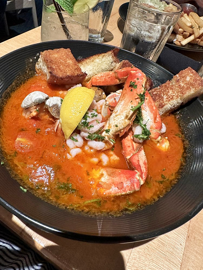 The seafood stew arrives like an edible treasure chest&mdash;crimson broth cradling plump shrimp and tender fish with crusty bread standing by for the inevitable dipping frenzy.