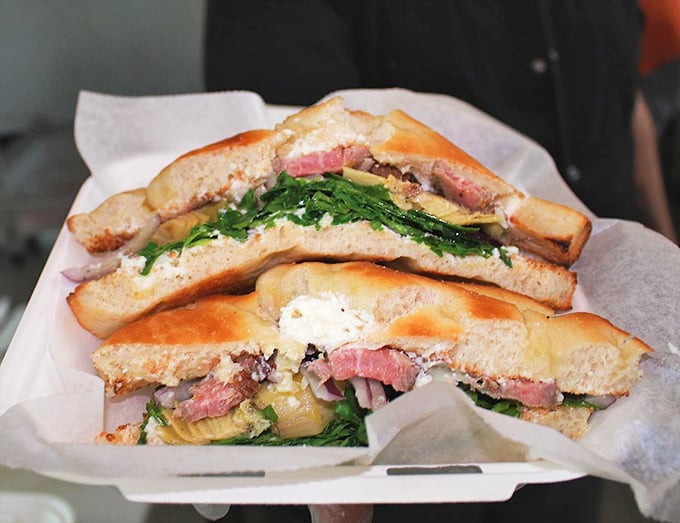 This isn't just a sandwich; it's a masterpiece of balance &ndash; crusty bread, tender meat, and vibrant greens creating the holy trinity of handheld perfection.
