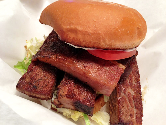The brisket sandwich arrives like Texas on a bun—smoky, substantial slices of beef that spent hours becoming tender just for this moment.