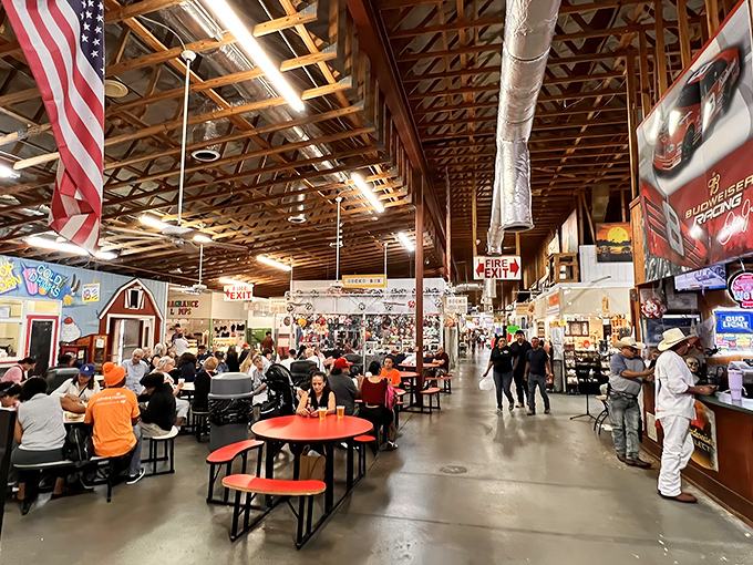 The food court serves as both refueling station and social hub, where shoppers compare finds under rustic wooden rafters and American flags.