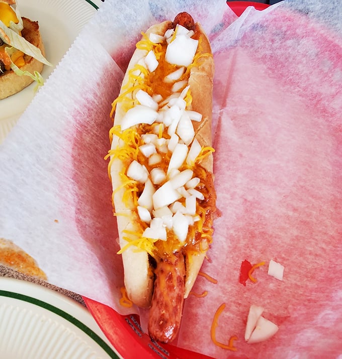 Hot dog royalty! This footlong comes dressed to impress with cheese, onions, and enough personality to make ordinary hot dogs feel inadequate.