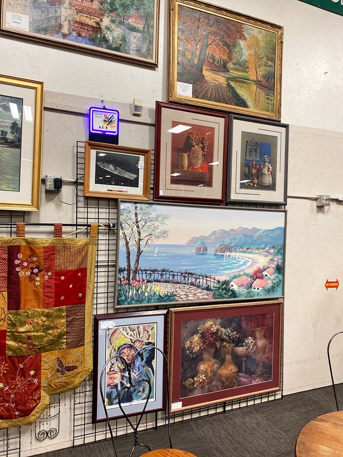 Wall-to-wall nostalgia in framed form. That seaside painting might not match your decor, but it matches someone's childhood memory perfectly.