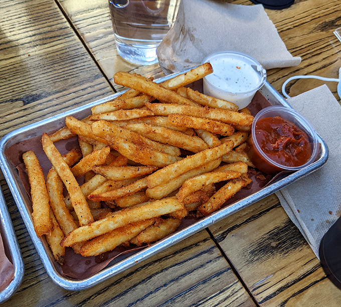 Golden fries seasoned to crispy perfection, because even the sides deserve star treatment at this barbecue wonderland.