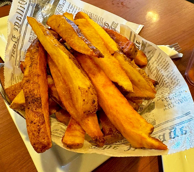 French fries served on newspaper &ndash; a crispy, golden tribute to simpler times when calories didn't count during vacation.