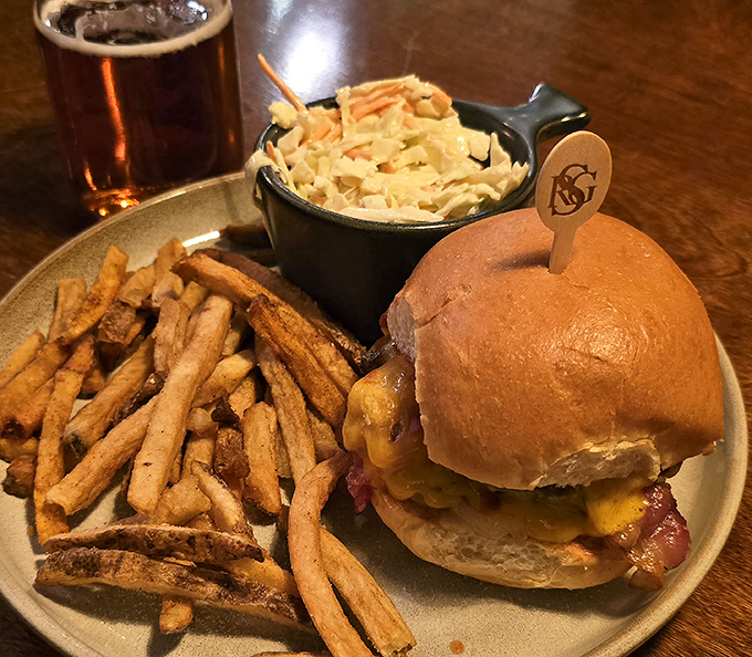 The classic American trinity: a perfectly toasted bun, melty cheese, hand-cut fries, and coleslaw that isn't an afterthought.