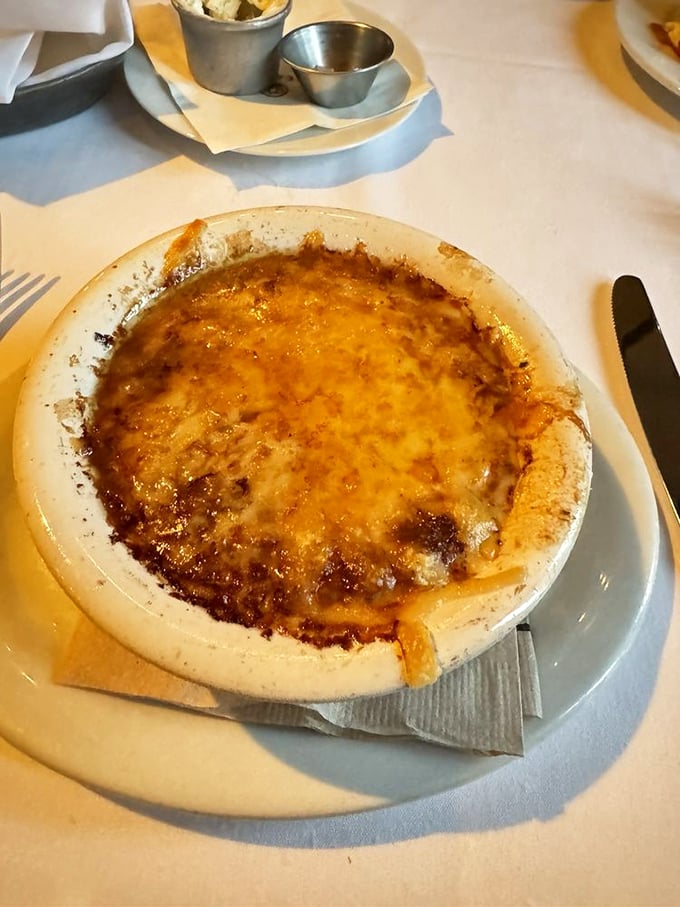French onion soup so authentic it needs a passport&mdash;that golden cheese cap conceals a savory broth worth diving into headfirst.