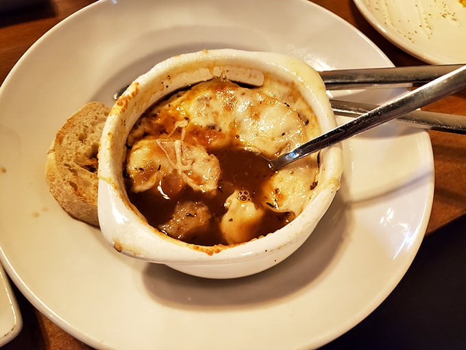 French onion soup that's worth the cheese pull. This bubbling cauldron of comfort comes with a side of nostalgia and crusty bread.