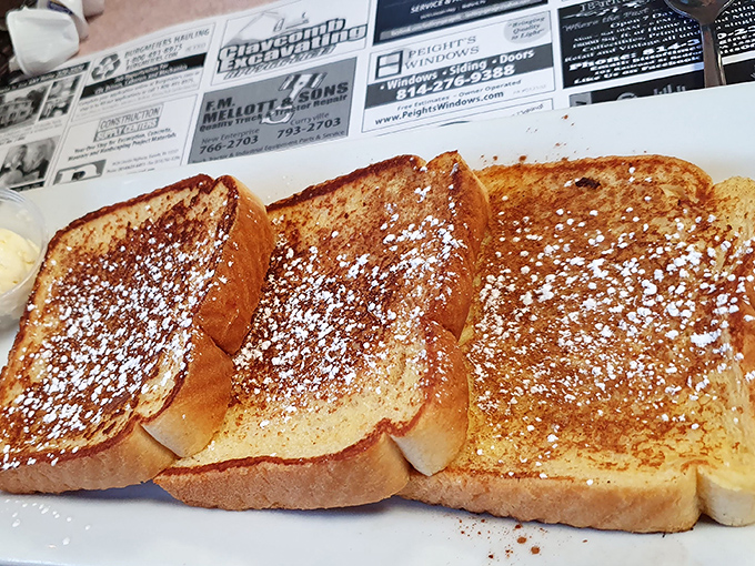 French toast dusted with powdered sugar like the first perfect snowfall of winter&mdash;simple breakfast perfection that needs no Instagram filter.