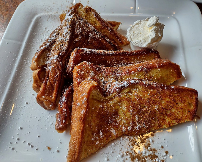 This isn't just French toast&mdash;it's a golden-brown masterpiece dusted with powdered sugar that transforms ordinary bread into breakfast royalty.