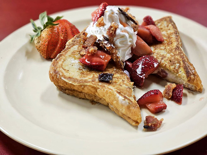 French toast that doesn't need a passport to impress&mdash;crowned with fresh strawberries and whipped cream, it's breakfast royalty in disguise.