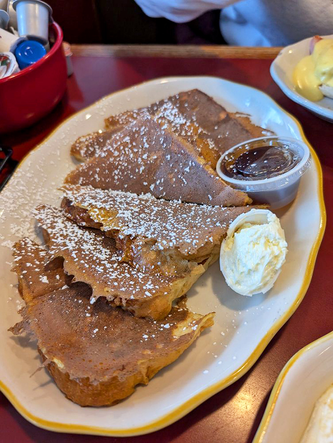 French toast dusted with powdered sugar &ndash; the kind that makes you wonder why anyone bothers with fancy brunch reservations elsewhere.