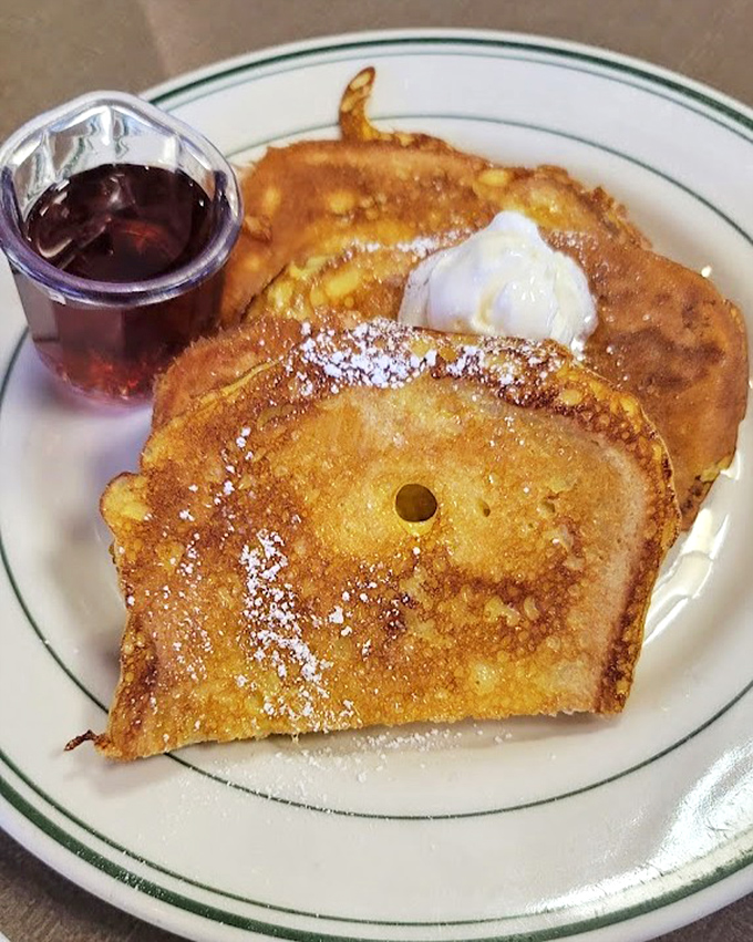 French toast that's had a proper education &ndash; golden, crisp edges with a custardy center that makes maple syrup feel like it's finally found its purpose.
