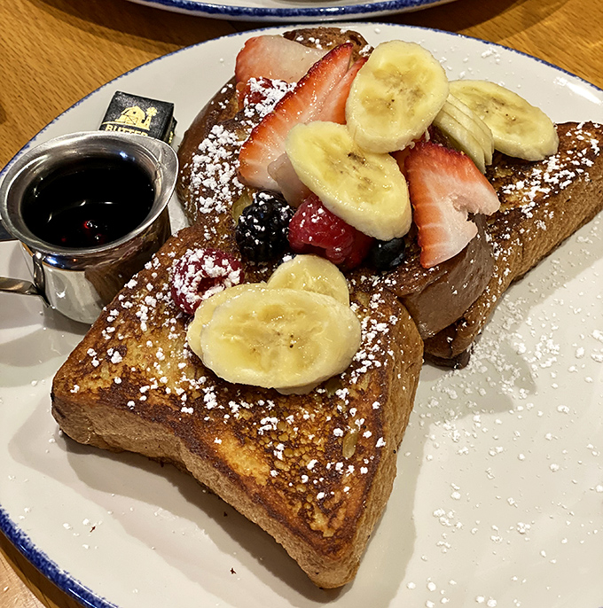 French toast that doesn't just arrive &ndash; it makes an entrance. Fruit, powdered sugar, and maple syrup create breakfast's answer to formal evening wear.