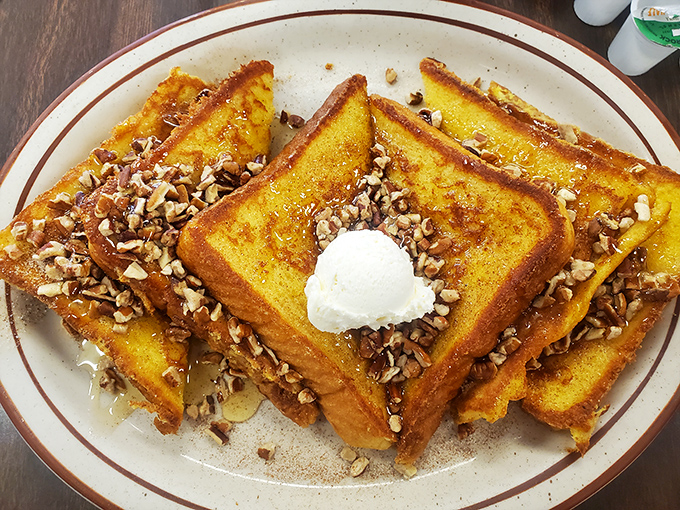 French toast that could make you weep &ndash; golden-brown perfection topped with pecans and a dollop of whipped butter melting into every crevice.