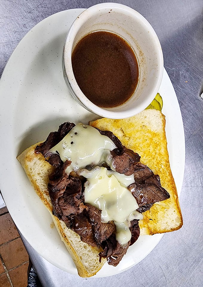 This open-faced sandwich isn't just lunch&mdash;it's a masterpiece of tender beef, melted cheese, and savory au jus for dunking.