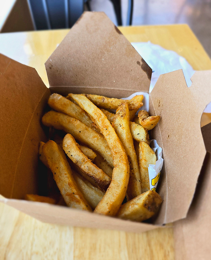 French fries so perfectly golden and seasoned, they make you question whether they deserve to be called a "side" rather than a main event.