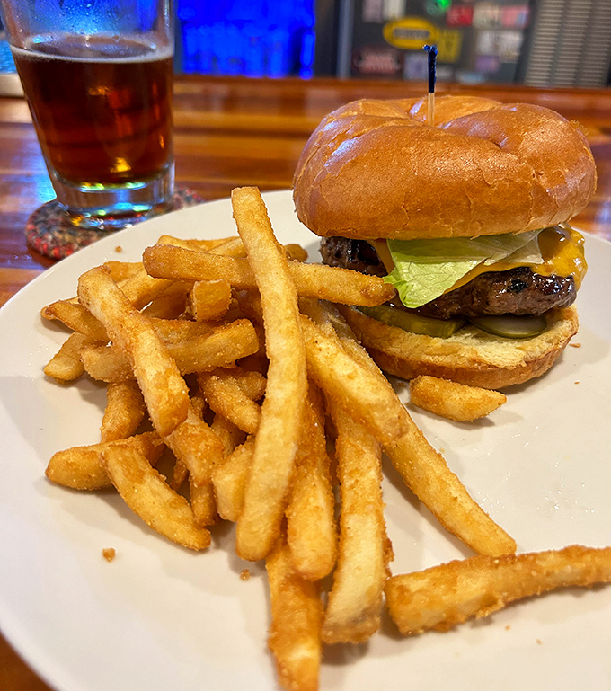 The classic combo that never disappoints: a perfectly charred burger with a mountain of crispy fries&mdash;comfort food that speaks a universal language.