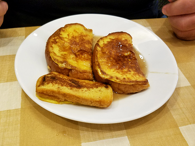 French toast that looks like it bathed in custard before hitting the griddle&mdash;breakfast that doubles as dessert without a hint of remorse.