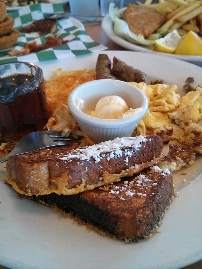 French toast that dreams are made of&mdash;dusted with powdered sugar and served with all the breakfast fixings.