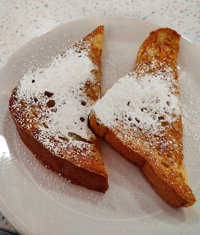 Golden French toast dusted with powdered sugar snow &ndash; breakfast masquerading as dessert, and nobody's complaining.