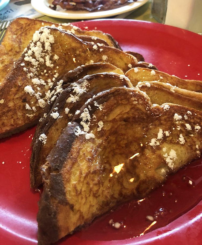 Golden-brown French toast dusted with powdered sugar&mdash;proof that bread's highest calling was never meant to be a sandwich.