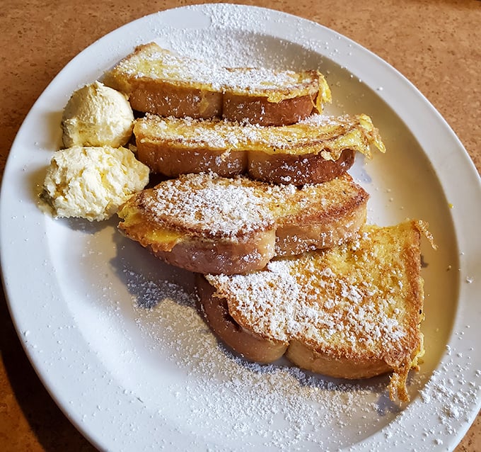 French toast so perfectly golden and dusted with powdered sugar, it could make a pastry chef weep with joy. Breakfast or dessert? Yes.