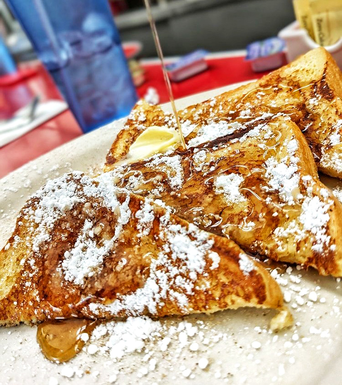 French toast that makes you question why anyone would eat cereal. That syrup cascade is nature's most beautiful waterfall.