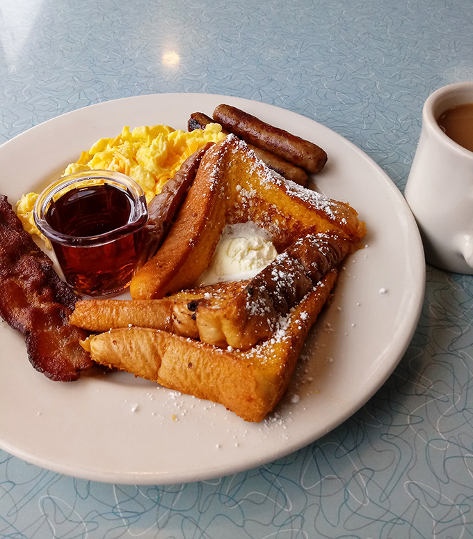 French toast that makes you question why anyone would ever skip breakfast, dusted with powdered sugar like fresh Chicago snow.