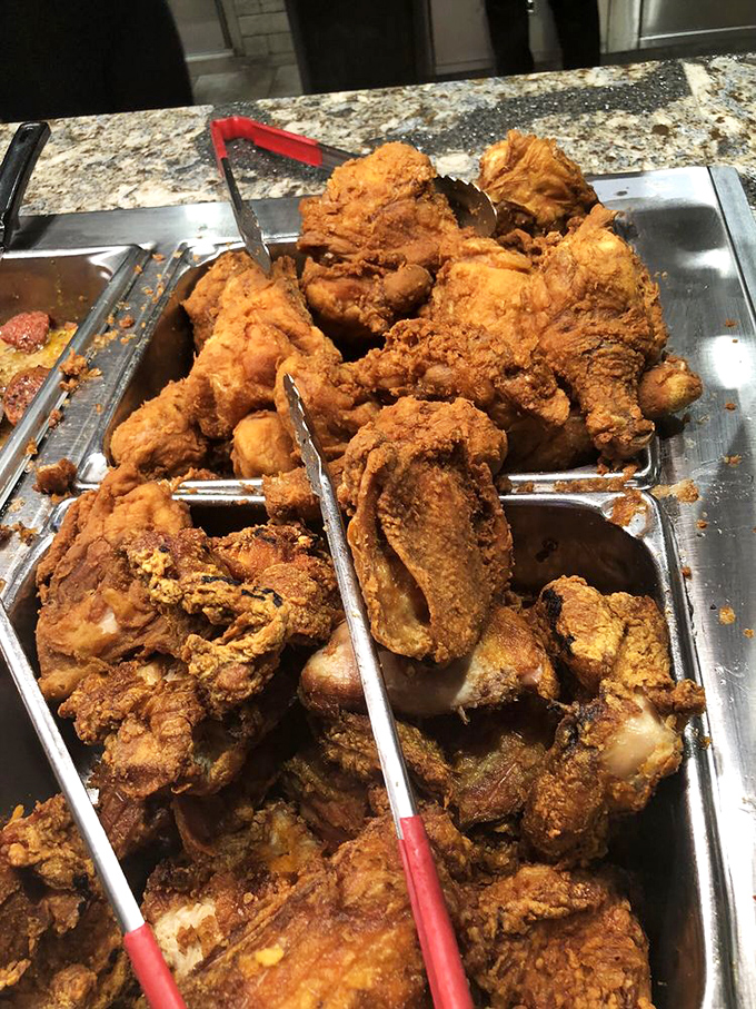 The fried chicken station, where poultry goes to achieve its highest purpose: becoming the crispiest, most golden version of itself.