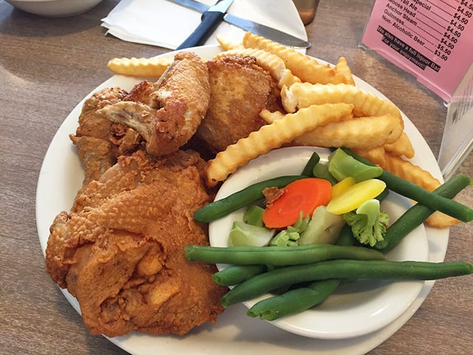 Golden-fried chicken that would make Colonel Sanders weep with jealousy, served with crinkle-cut fries and vegetables that actually taste like vegetables.