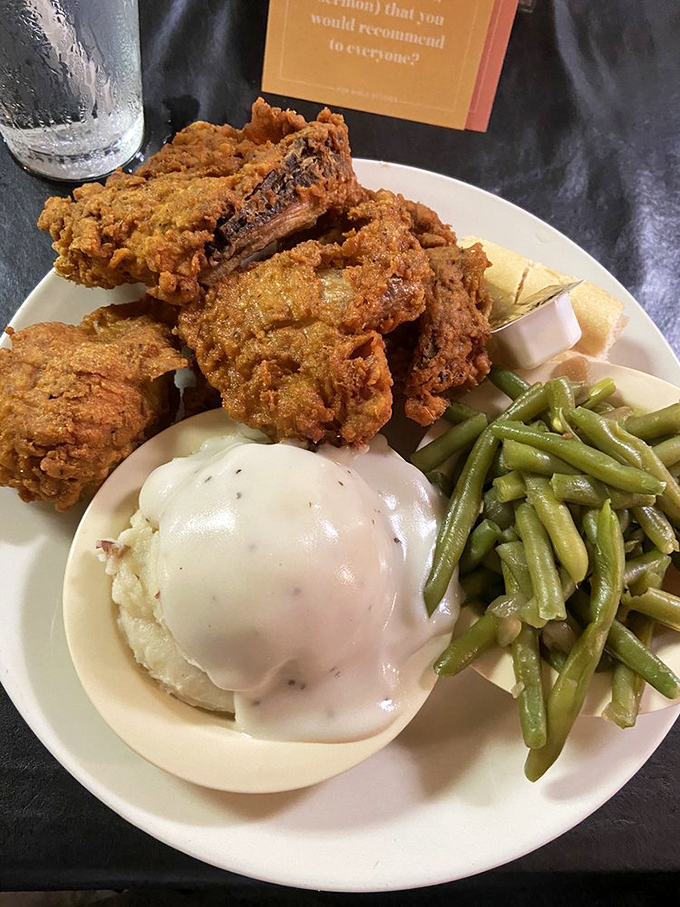 Fried chicken that would make your grandmother both jealous and proud, paired with mashed potatoes under a gravy blanket and green beans for "balance."
