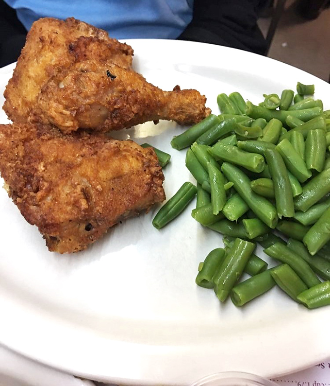 Fried chicken that would make Colonel Sanders question his life choices. Perfectly golden, audibly crunchy, and paired with those vibrant green beans.
