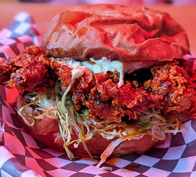 The fried chicken sandwich that launched a thousand cravings&mdash;a crimson-hued masterpiece where crunch meets tenderness in perfect harmony.