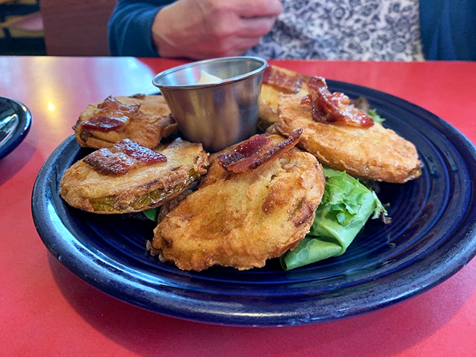Fried green tomatoes with crispy exteriors and tangy centers &ndash; proof that sometimes the best things in life are simple and golden brown.