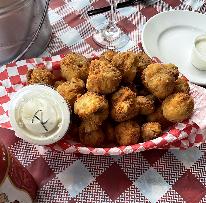 These fried mushrooms aren't mere appetizers—they're little umami bombs waiting to detonate on your taste buds. The dipping sauce is just a bonus round.