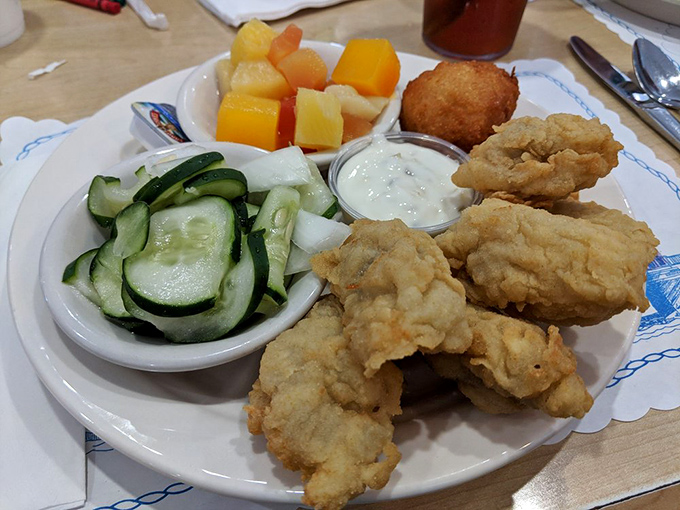 Golden-fried oysters and fresh sides&mdash;proof that simplicity, when executed perfectly, beats culinary gymnastics every time.