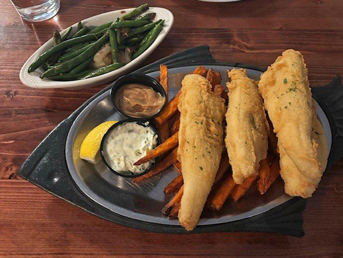 Lake Erie perch fried to golden perfection with sweet potato fries and homemade tartar sauce&mdash;proof that sometimes the best seafood isn't from the ocean.